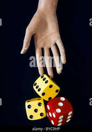 Hand rolling dice. Roll of the dice Stock Photo - Alamy
