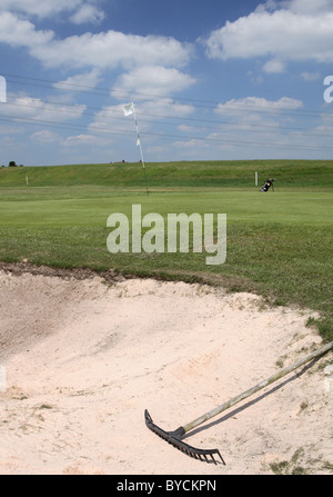 Sand Bunker Hazard and rake on Golf Course Fairway Stock Photo - Alamy