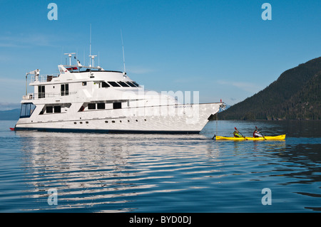 Alaska. Safari Quest and kayakers in Windham Bay in the Chuck River ...