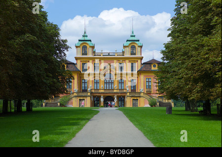 Front view of Schloss Favorite baroque palace framed by tree-lined ...