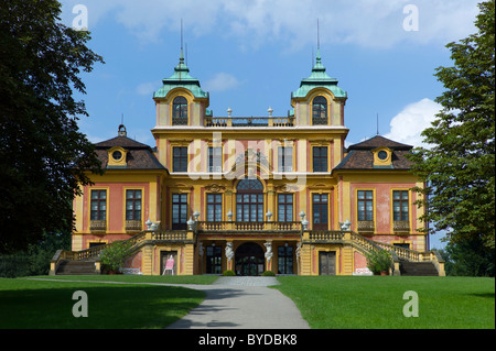 Front view of Schloss Favorite baroque palace framed by tree-lined ...
