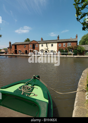 A narrowboat by the pub The Swan at Fradley Junction in Staffordshire ...