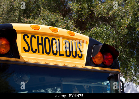 Top of a yellow school bus with lights and text. Back to school concept ...