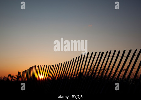 USA, Massachusetts, Barnstable, Fence along Cape Cod sand dunes at ...
