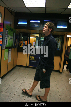 Brian McFadden placing a bet in a bookmakers in Primrose Hill London ...
