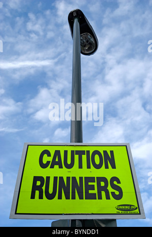 Caution runners sign Stock Photo - Alamy