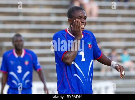 Member of Haitian National Soccer team stretches his legs during warm ...