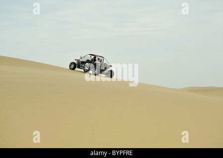 Swakopmund, Namibia, landscape, 4x4 ATV buggy racing up sand dune ...