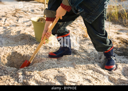 holes in beach sand Stock Photo - Alamy