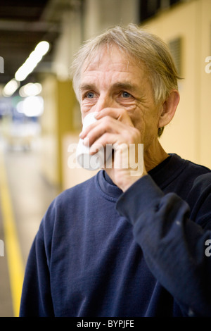 Mature Man Drinking Coffee in Bathtub Stock Photo - Alamy