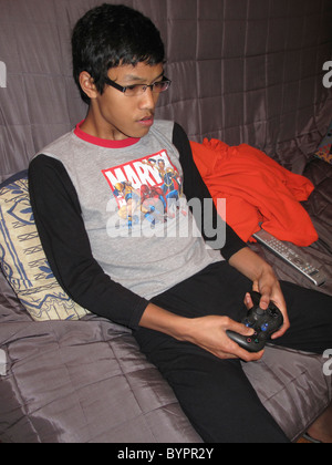 boy playing with video game, sony PS3 Stock Photo - Alamy