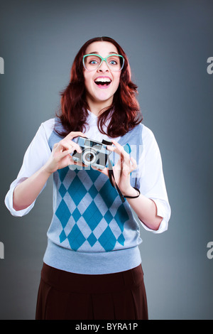 Geeky woman smiling at camera Stock Photo - Alamy