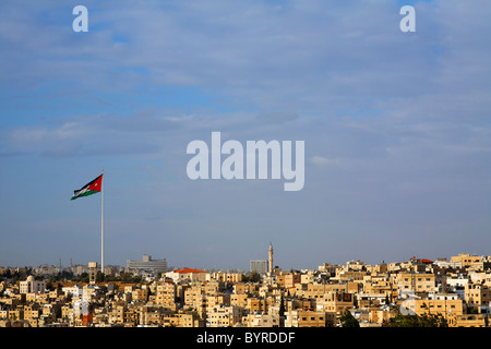 The city of Amman with the Jordanian flag flying; Jordan Stock Photo ...