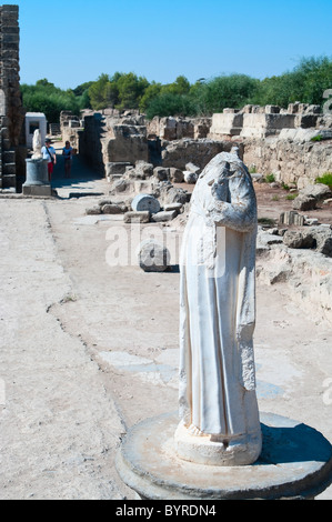 The ruins in Salamis Ancient City in Cyprus with a blue skyscape in the ...