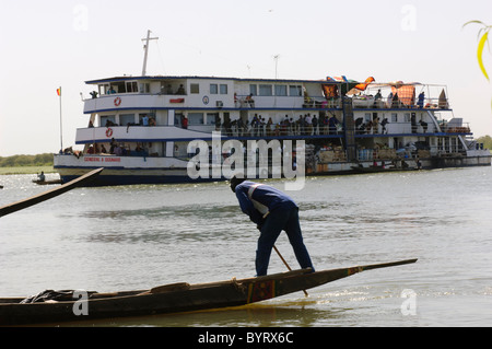 Mali, Niger Inland Delta. A pirogue under sail on the Niger River ...