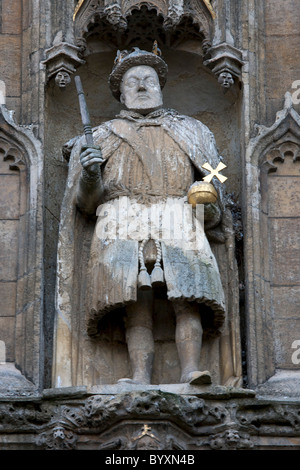 Statue of Henry VIII holding the leg of a chair, Trinity College ...
