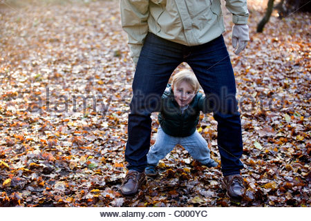 Father and son looking through their legs Stock Photo: 58783324 - Alamy