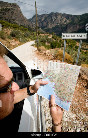 young traveller checking map Stock Photo - Alamy