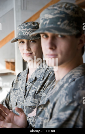 Close-up of soldiers in camouflage uniforms standing in line with ...