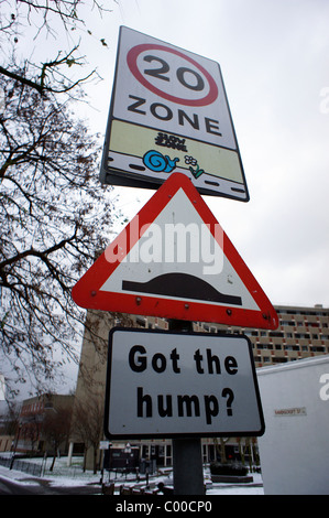 Humps in road traffic warning red triangle road sign on metal pole with ...