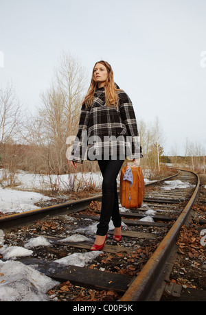 a sad girl on railway tracks Stock Photo - Alamy