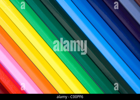 Multi-colored pencils on color background Stock Photo - Alamy