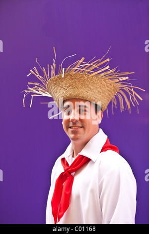 A man dressed in traditional Puerto Rican costume with chicken San ...