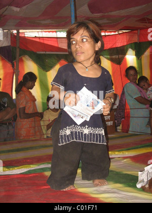 TINY PEOPLE Twenty six-year-old Manju Ghimire sits on top of a stage at ...