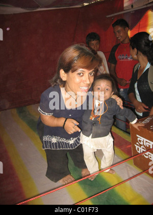 TINY PEOPLE Twenty six-year-old Manju Ghimire sits on top of a stage at ...