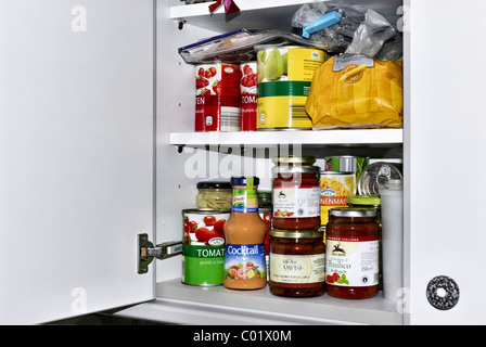 Kitchen cabinet, convenience food products. Ready-to-serve meals, meat ...