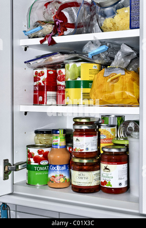 Kitchen cabinet, convenience food products. Ready-to-serve meals, meat ...