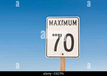 A traffic sign with a cracked surface reads Maximum 70 Stock Photo - Alamy