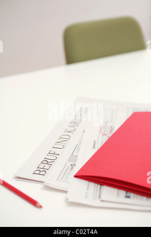 Job application, documents and daily newspaper Stock Photo - Alamy