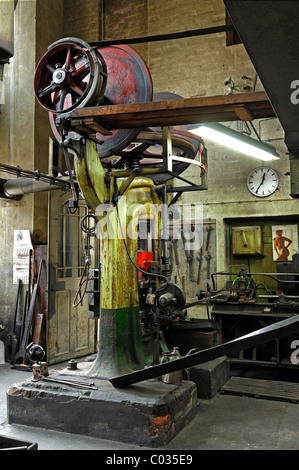 Forging press on a line shaft power transmission system in an old drop ...