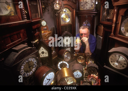 Fixing a grandfather clock Stock Photo - Alamy