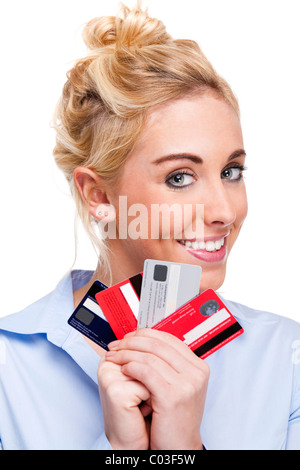 Beautiful young woman with credit cards and shopping bags on red ...