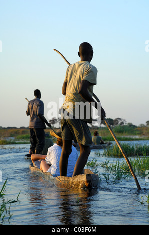 Punters with tourists in the traditional Mokoro dugout canoes on ...