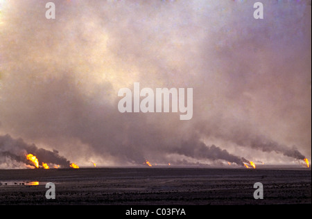 Oil wells burn in the Kuwait desert after the Iraqi army destroyed the ...