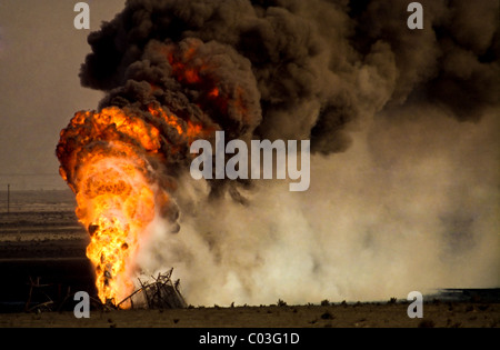 Oil wells burn in the Kuwait desert after the Iraqi army destroyed the ...