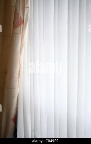 Close-up of white voile blind on small window Stock Photo - Alamy