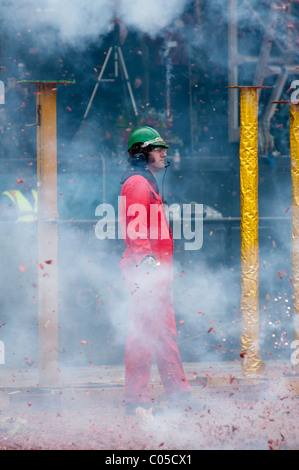 Man lighting a fire cracker during the festival of Diwali. These are ...
