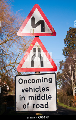 Road narrows traffic sign at the street intersection Stock Photo - Alamy