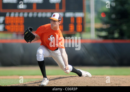 Left-handed pitcher delivering a pitch to a waiting hitter during a ...