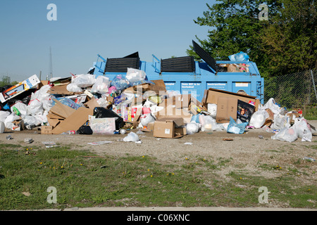 Recycle center drop off container overflows with bags and boxes of ...