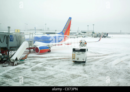 An American Airlines plane is de-iced at Chicago O'Hare International ...