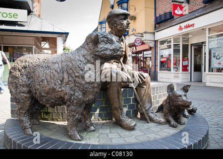 Bronze statue of a sheep farmer with sheep and dog in Petersfield ...