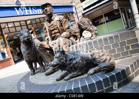 Bronze statue of a sheep farmer with sheep and dog in Petersfield ...
