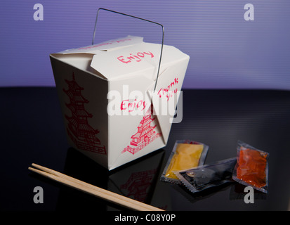 Take out chinese food cartons of pork fried rice and chicken fingers ...