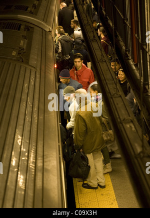 NYC subway system is jammed during the evening rush hour. Grand Central ...