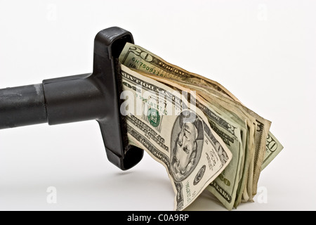 Cash being sucked into a vacuum cleaner Stock Photo - Alamy